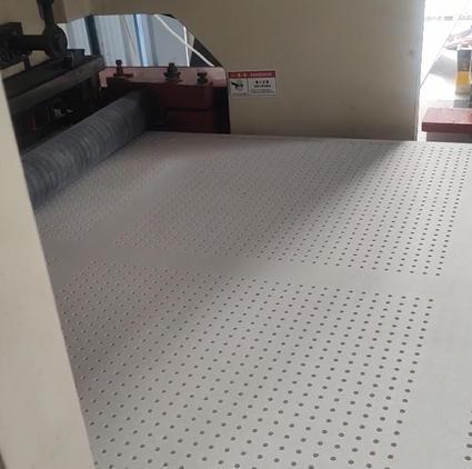 Fully Automatic Sound Absorbing Board Punching Machine in operation