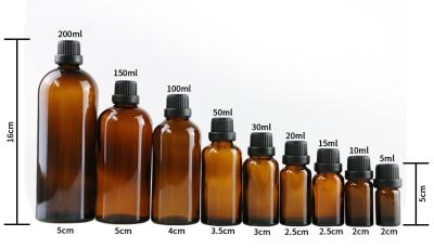 China Clear Amber Glass Essential Oil Bottles 50ml 100ml 200ml With Black Cap for sale