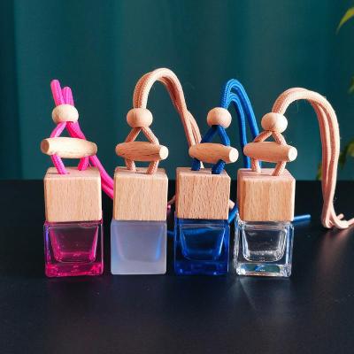 China 8ml Colored Glass Car Perfume Bottle with Wooden Lid for sale