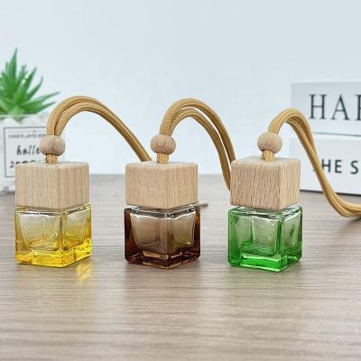 China 8ml Square Colored Bottle Car Perfume Brands Car Air Freshener With Screw Wood Lid for sale