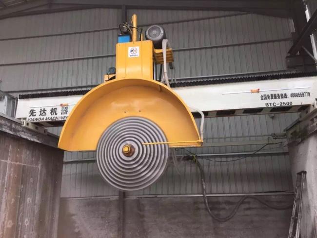 Close-up view of bridge cutting machine blade and mechanism