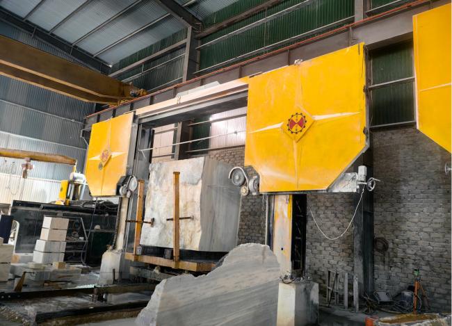 Close-up view of diamond wire saw cutting process