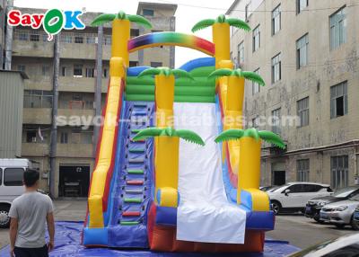 China Slide gonfiabile commerciale 8*4*7m PVC Coconut Tree Slide gonfiabile Bouncer con due soffiatore per bambini for sale