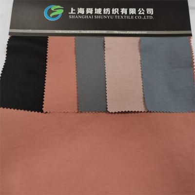 Cina poli materiale del rivestimento del poliestere del tessuto di miscela dell'elastam della piega 160gsm T400 Wr in vendita