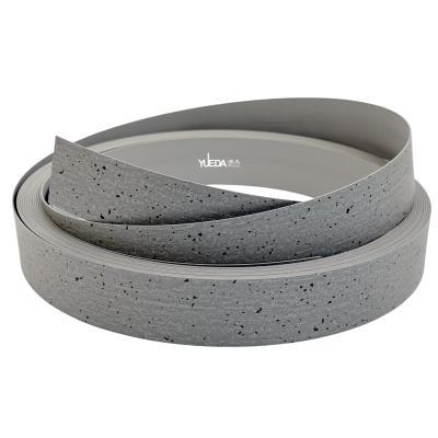 China Concrete Grey Speckled PVC Edge Banding | YUEDA Furniture Edge Trim for sale