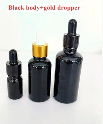 Cina 5 ml 10 ml 15 ml 20 ml 30 ml 50 ml 100 ml Bottiglia nera di olio essenziale Bottiglia di vetro per gocce in vendita