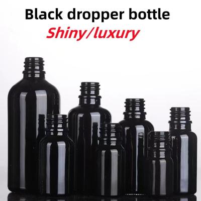 Cina 10ml 15ml 20ml 30ml 50ml 100ml Olio essenziale nero lucido Bottiglia di vetro per gocce cosmetiche in vendita