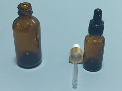 Cina Imballaggio dell' olio essenziale 1OZ 2OZ 20ml 30ml 50ml siero di olio essenziale di ambra Bottiglia gocciolante di vetro con tappo a prova di bambino in vendita