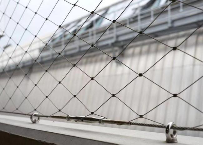 Close-up of stainless steel cable mesh structure