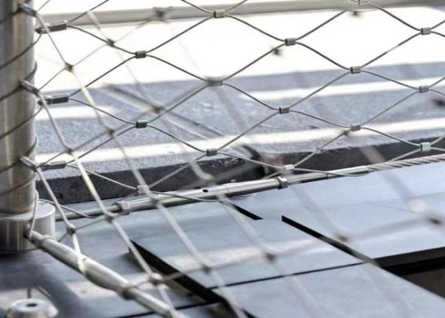 Close-up of wire rope mesh connections