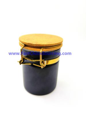 China custom 150ML black BOROSILICATE glass jar WITH bamboo lid with gold clamp , gross and matt surfaces for sale