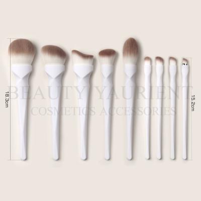 Cina 9pcs che tutti in un set di pennelli bianco di trucco del fronte hanno brevettato il cosmetico di stile di X spazzolano i corredi di trucco in vendita