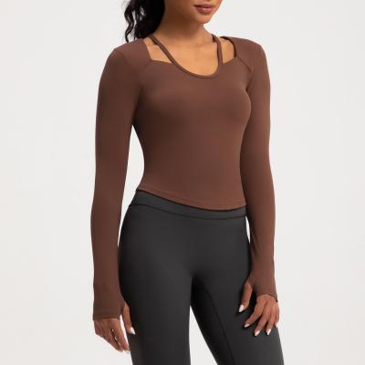 China Brown Cutout Long Sleeve Yoga Top Buttery Soft Compression Fabric Thumbholes Design for Workout Running and Daily Wear for sale