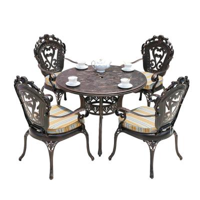 China Waterdichte villa ronde patio eetkamer tuin gegoten aluminium barbecue tafel en 6 stoelen Te koop