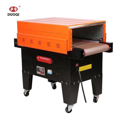 China DUOQI BS-G4525 Semi Automatic Heat Shrink Tunnel Box Wrap Sealer Pet Bottle Shrink Wrapping Machine for sale