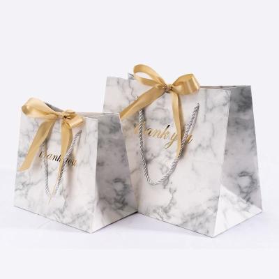 China Bolsas de presente personalizadas com arcos para roupas, jóias e embalagens de presentes à venda