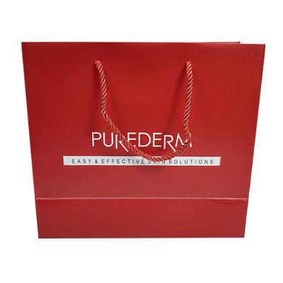 Cina Stampa offset con manicotto di patch, sacchetto di carta per acquisti personalizzati durevoli e riciclabili in vendita