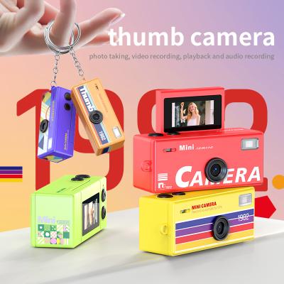 China DLC Kids Mini Flip Screen Thumb Camera HD Small Portable Pocket Camera Student Recording Camera for sale