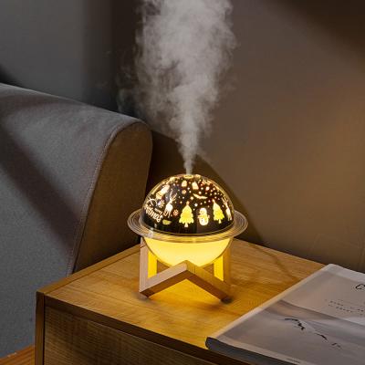 中国 250ML Ultrasonic Humidifier Saturn Projector LED Lamp With Star Sky Ocean World Christmas Colorful USB 販売のため