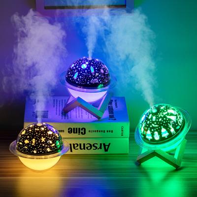 中国 250ML Ultrasonic Humidifier Saturn Projector LED Lamp With Star Sky Ocean World Christmas Colorful USB 販売のため