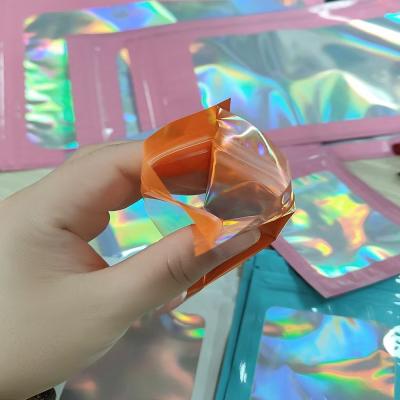 China Retort Pouch Transparent Window Packaging Plastic Bag 13x25cm Self Sealing Holographic Mylar Bag with Zipper Gravure Printing for sale