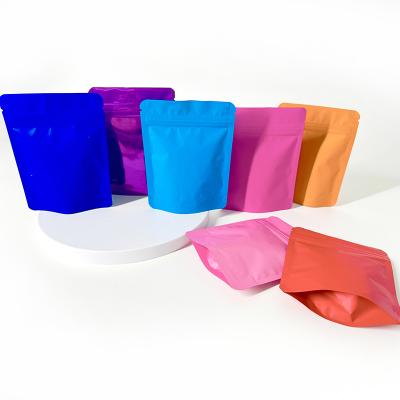 China Gravure Printing Customized Glossy Pure Gold Mylar Plastic Stand Pouch Holographic PET Packaging Bag Smell Proof Protective for sale