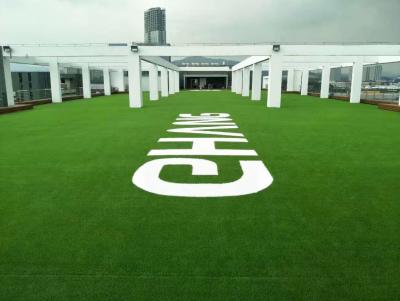 China PP Net SBR Latex Artificial Grass Turf 12-20 Stitches PP Woven Bag Drainage Holes for sale