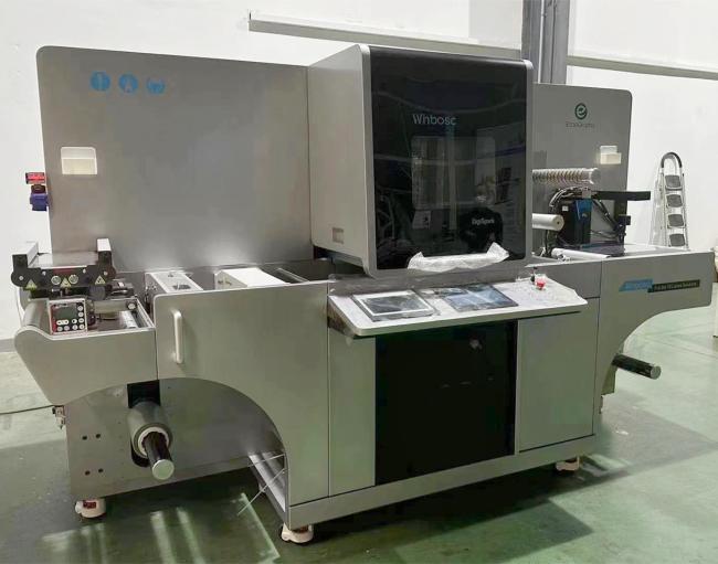 Full production setup of EcooSpark machine with operator