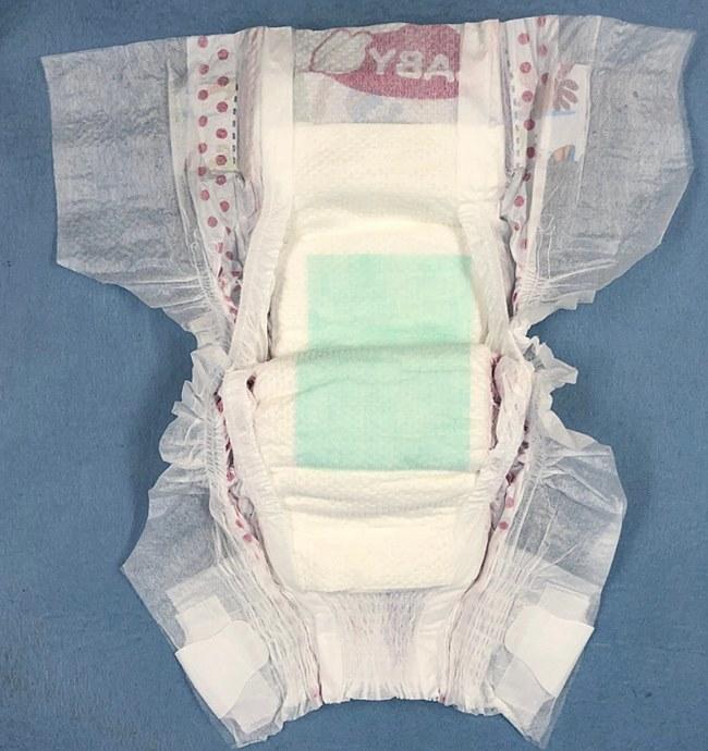Three Pigsbaby disposable diaper close-up showing absorbent layers