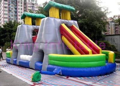 China A corrediça seca inflável da canela cinzenta do castelo com a rampa de lançamento vermelha/amarelo fundiu pelo ventilador do CE à venda
