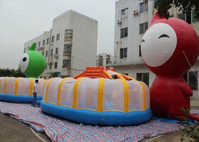 中国 0.55mmの障害物コースの屋外の巨大で膨脹可能な二重車線のスライド 販売のため