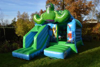China Kids Inflatable Green Super Heroes Castle Jumping House With Slide for sale