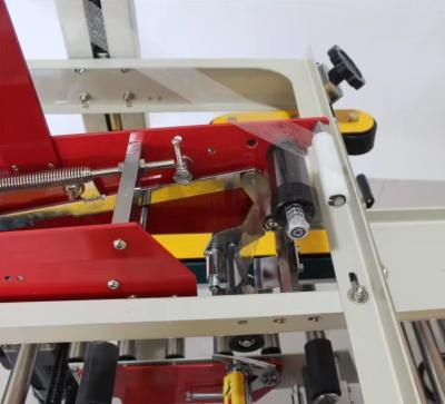 China FXJ-4030S Semi Automatic Tape Sealer Box Carton Left And Right Cross Sealing Machine for sale