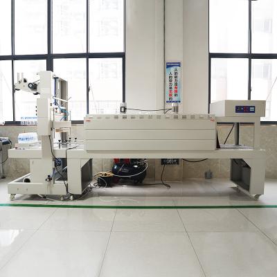China Máquina de embalagem de garrafas de água de PET de manga de 180 kg fácil a semi-automática para embalagem à venda