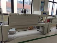 China Electric Driven Semi-automatic Water Bottle Shrink Wrapping Machine for Trays and Boxes for sale