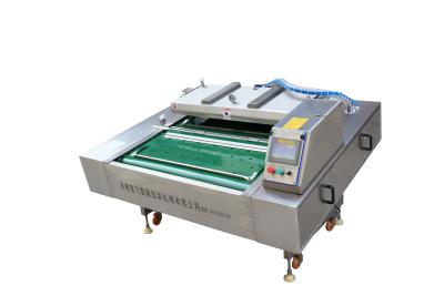 China Automatic Continous Rolling Belt Type Vacuum Packaging Machine for Fruit Meat Fish Chicken for sale