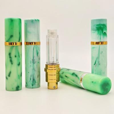 China Caneta de borracha de perfume de plástico portátil de 5ml personalizada com borracha de alumínio à venda