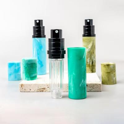 Cina Penna per profumi in plastica portatile marmorizzata da 5 ml personalizzata con spruzzatore in alluminio in vendita