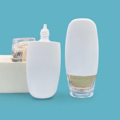 China 50ml Oval Shaped Luxury Gold Sunscreen Bottle - High-End Cosmetic Plastic Bottle for Skincare for sale