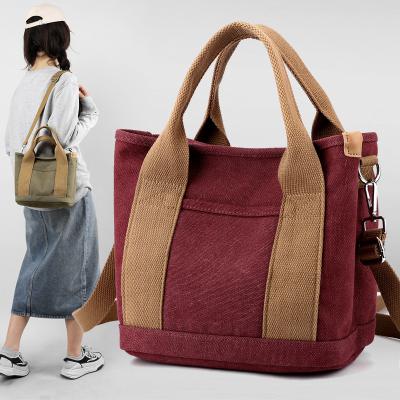 China Thickened Canvas Shoulder Bag with Large Capacity Multi-Compartment Commuting Bags for Students Compact Outings Tote with LOGO for sale