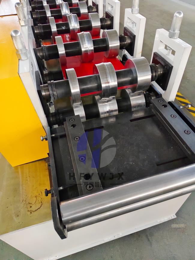 Close-up view of forming stations and rollers