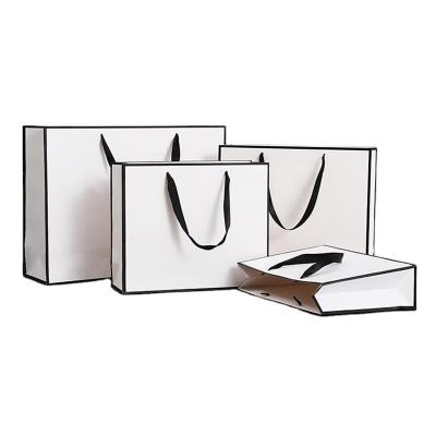 Cina Gift Craft Industrial Customized Kraft Paper Shopping Bag con maniglia a nastro in vendita