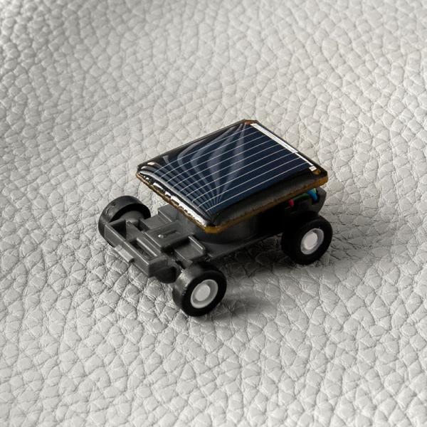 Quality Black Colored Novel Mini Solar Car Toys Small Juguetes Novedosos Customized Logo for sale
