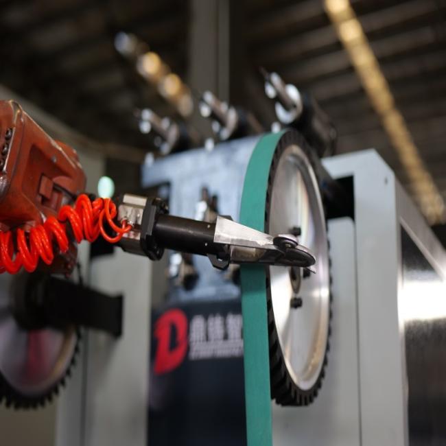 Automated grinding system for wheel hubs