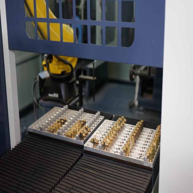 Precision grinding robot in manufacturing facility