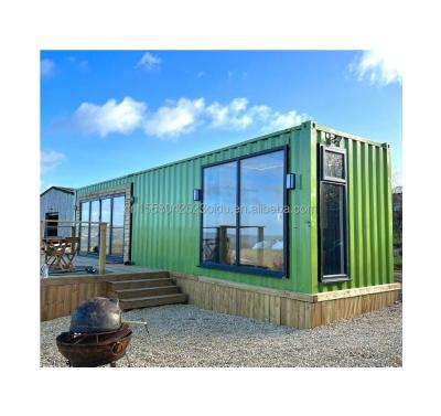 China 50/75/100mm Wave Sandwich Panel Wall Customizable Design 40ft Modified Shipping Container House for Living or Vacation for sale