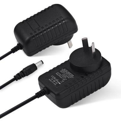 China Surge Protected 12v 2a Led Power Supply With Interchangeable Us/Eu/Uk/Au/Cn Plug for sale