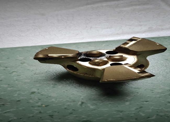 PDC concave carbide rock drag bit in drilling operation