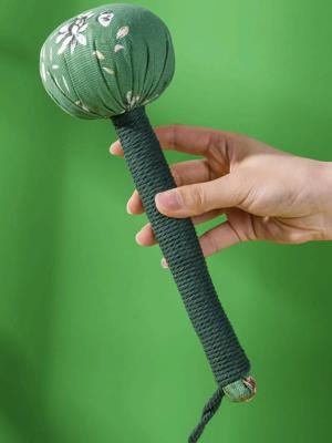 China Handmade mugwort massage hammer with natural dried mugwort, soft breathable cotton fabric, and anti-slip rope-wrapped handle for TCM meridian tapping for sale
