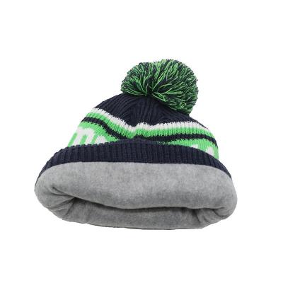 China Custom Color Complex Embroidery Label Patterns Pom Pom Beanie Warm Fleece Lined Beanies for sale